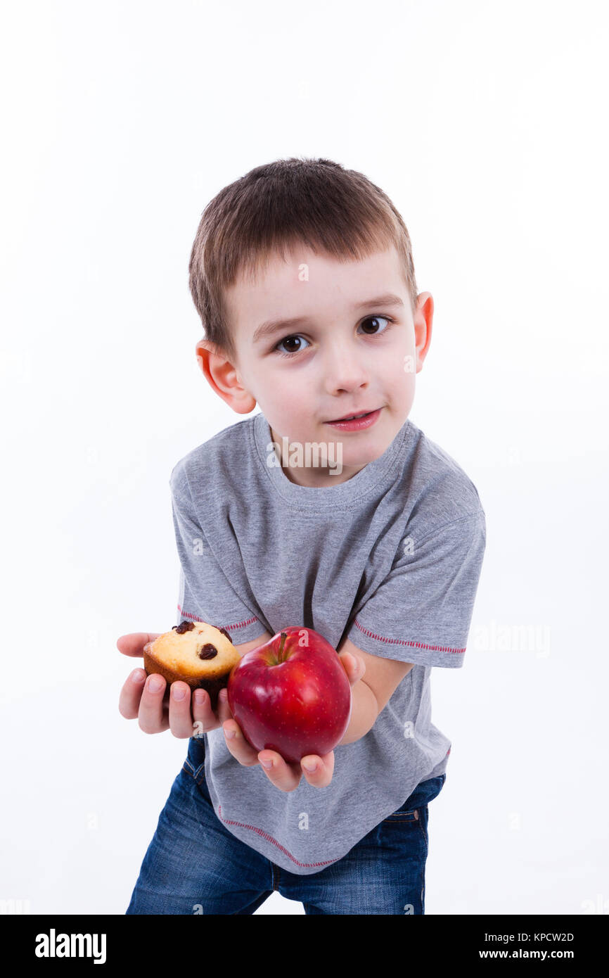 little boy with food isolated on white background - apple or a muffin ...
