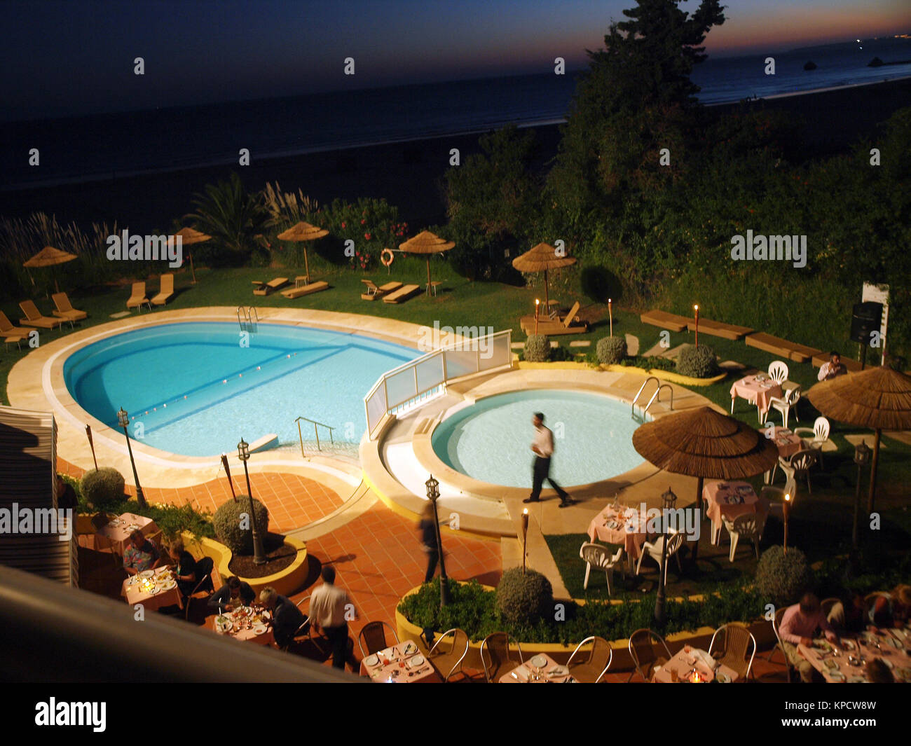 Lighted swimming pool at a seaside resort Stock Photo - Alamy