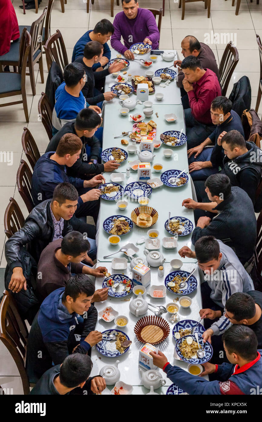A large Group Of Uzbek Men Eating PLOV (The National Dish) At The ...