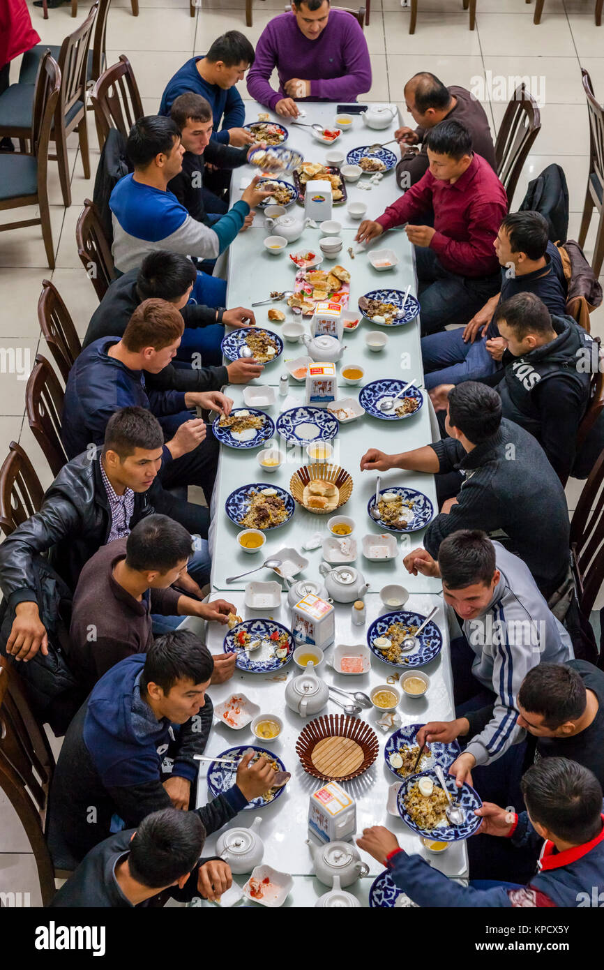 A large Group Of Uzbek Men Eating PLOV (The National Dish) At The ...