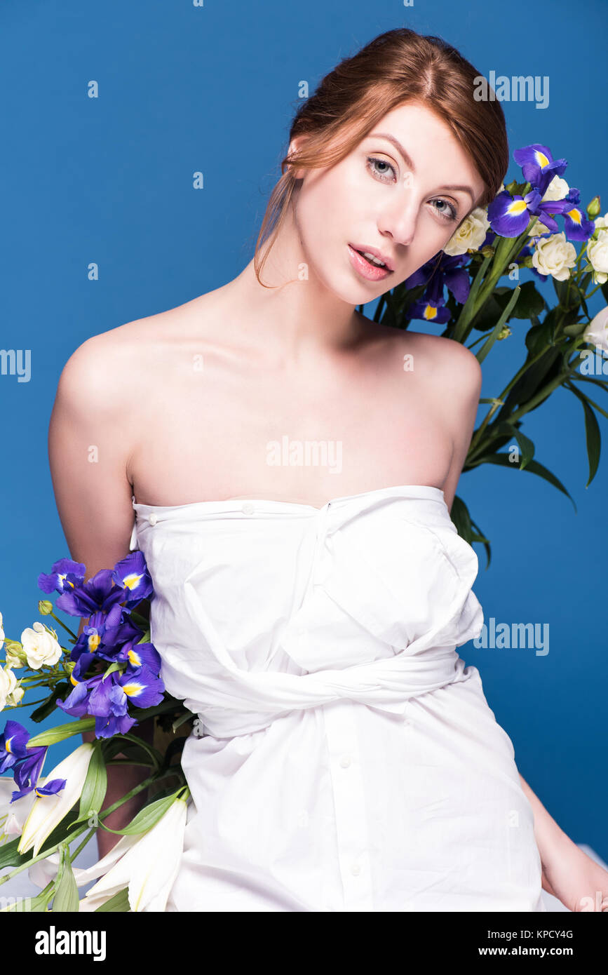 seductive young woman with flowers Stock Photo - Alamy
