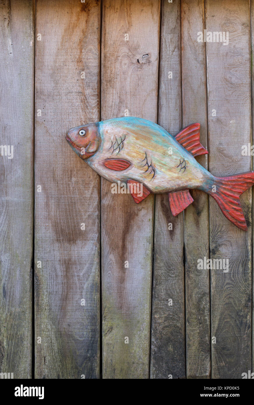 fish made of wood on wooden boards,background Stock Photo - Alamy