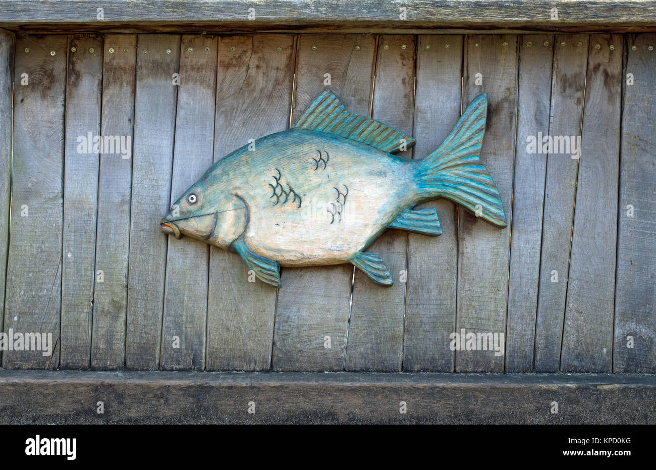 fish made of wood on wooden boards,background Stock Photo - Alamy