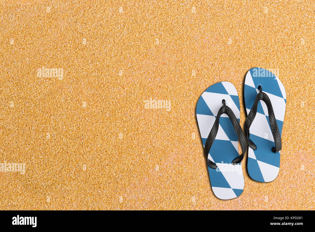 Bavarian flip flips on sand for background Stock Photo - Alamy