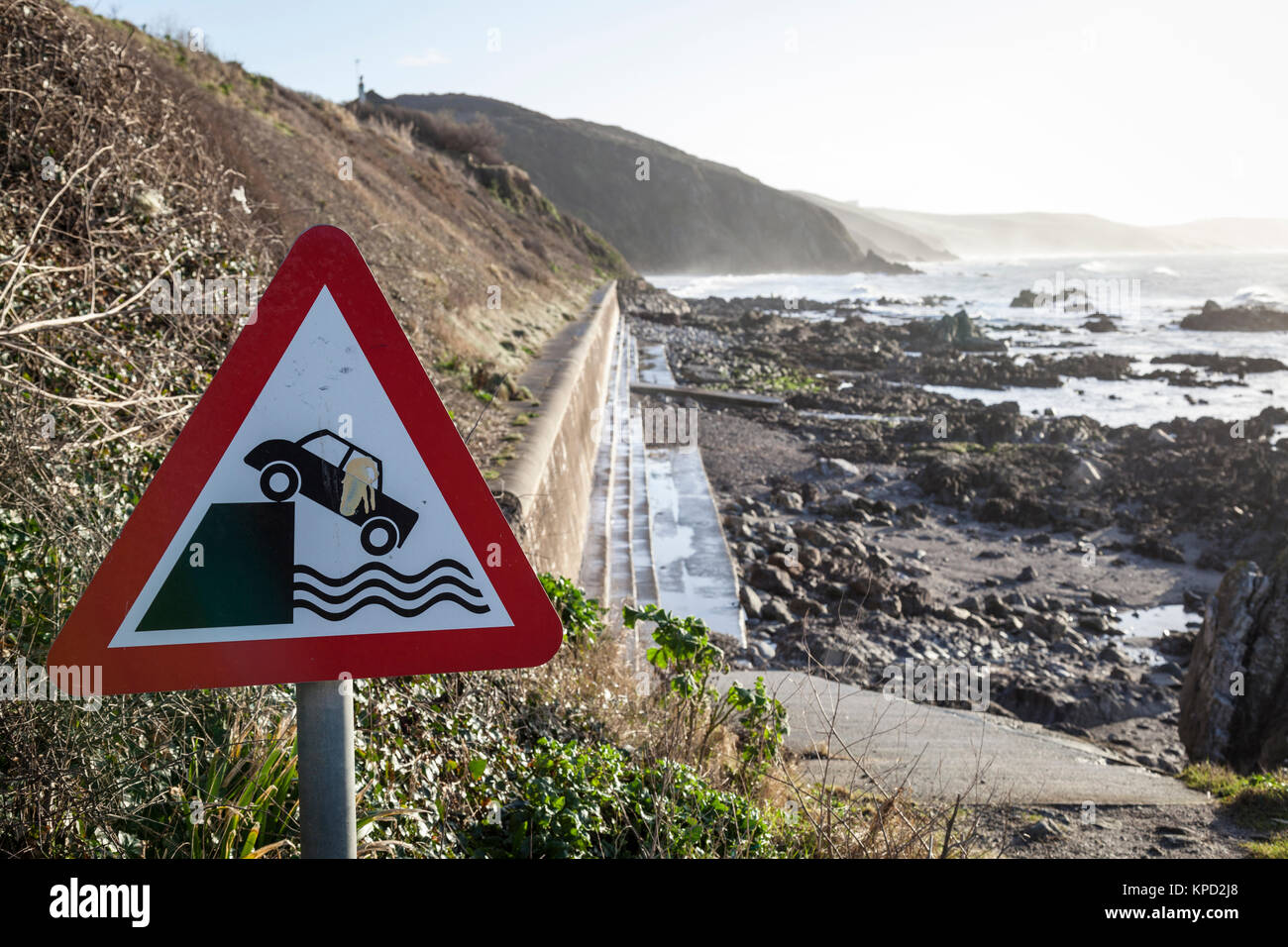 Quayside red Triangle warning sign by the small harbour at Portwrinkle ...