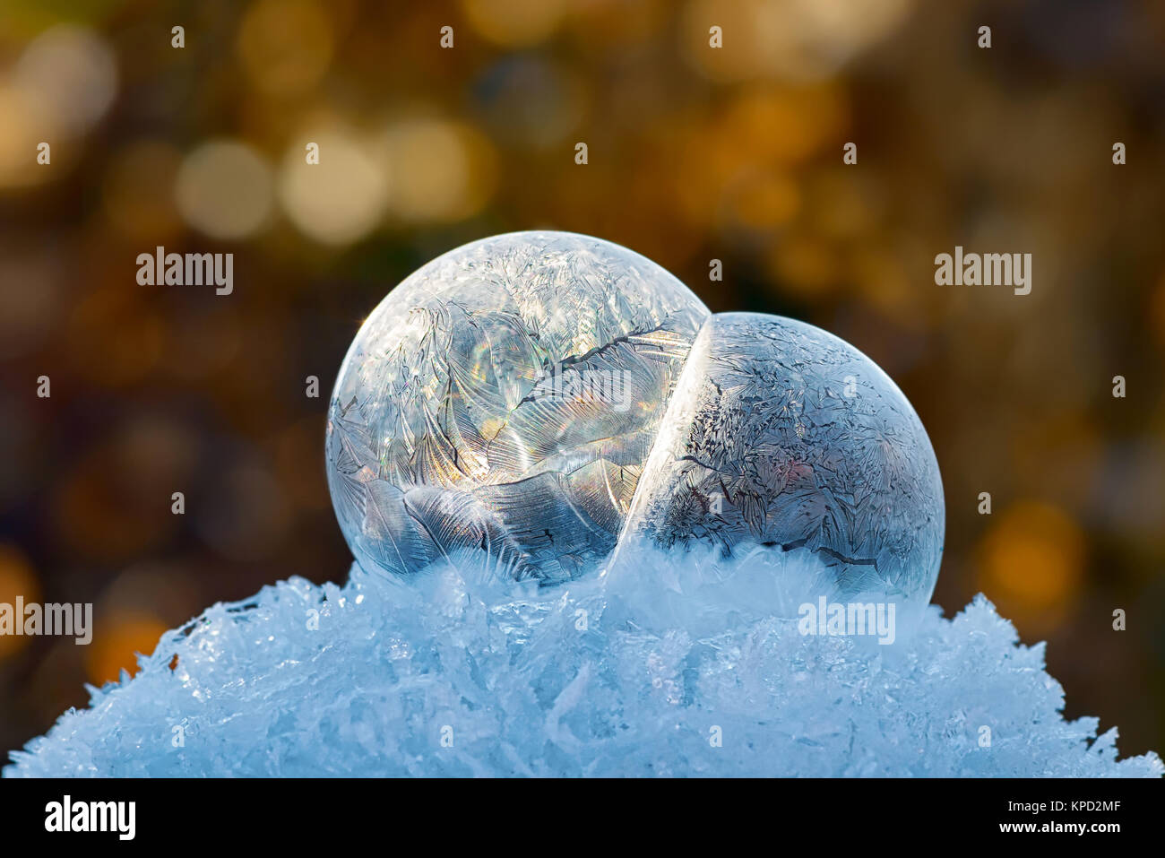 Close up of frozen soap bubbles with icy crystalline patterns on a cold ...