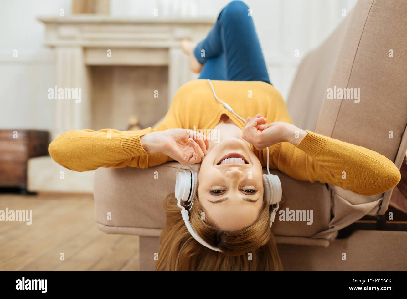 Gleeful smiling woman listening to music Stock Photo - Alamy