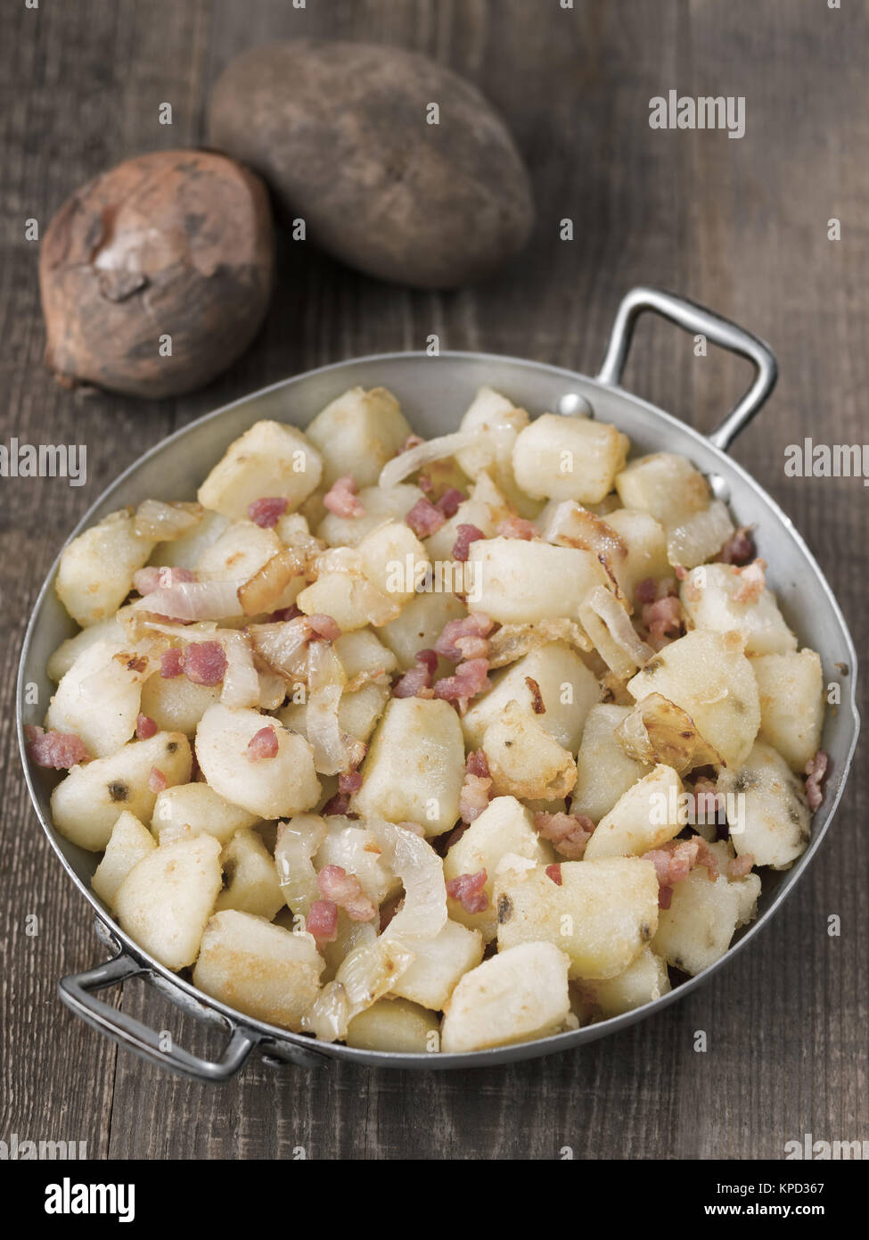 rustic german pan fried potato bratkartoffeln Stock Photo - Alamy