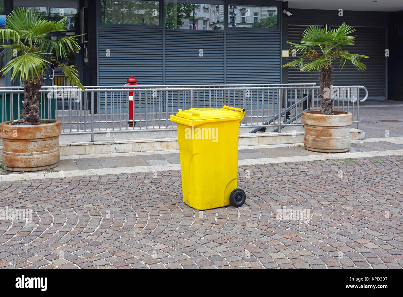 Yellow Plastic Garbage Bin Stock Photo - Alamy