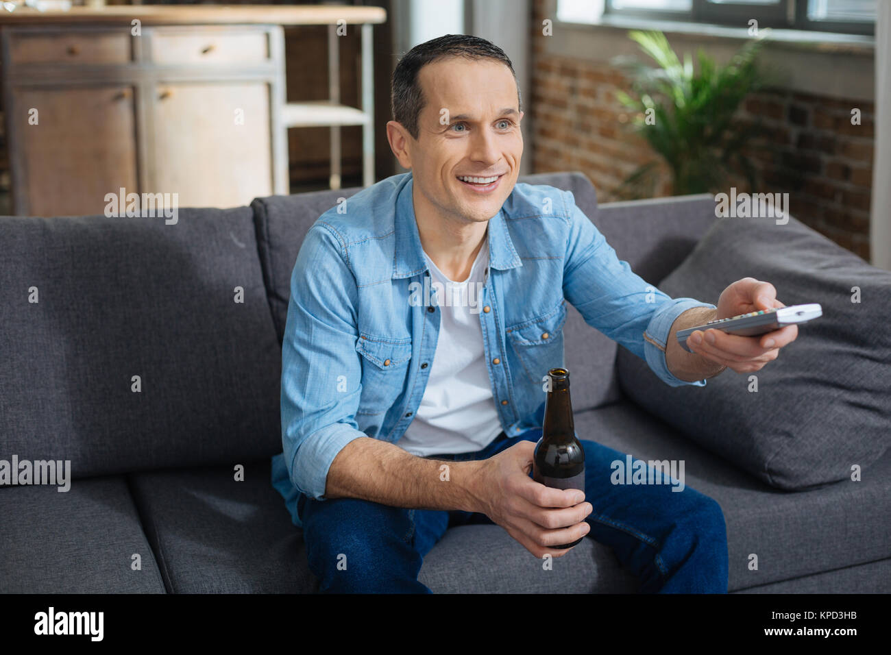 Person watching tv hi-res stock photography and images - Alamy