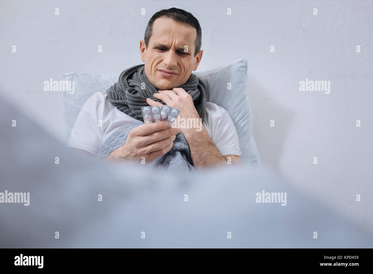 Unhappy person having unpleasant feelings Stock Photo - Alamy