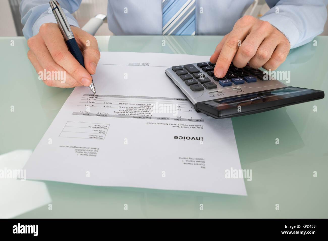 Businessman With Invoice And Calculator Stock Photo - Alamy