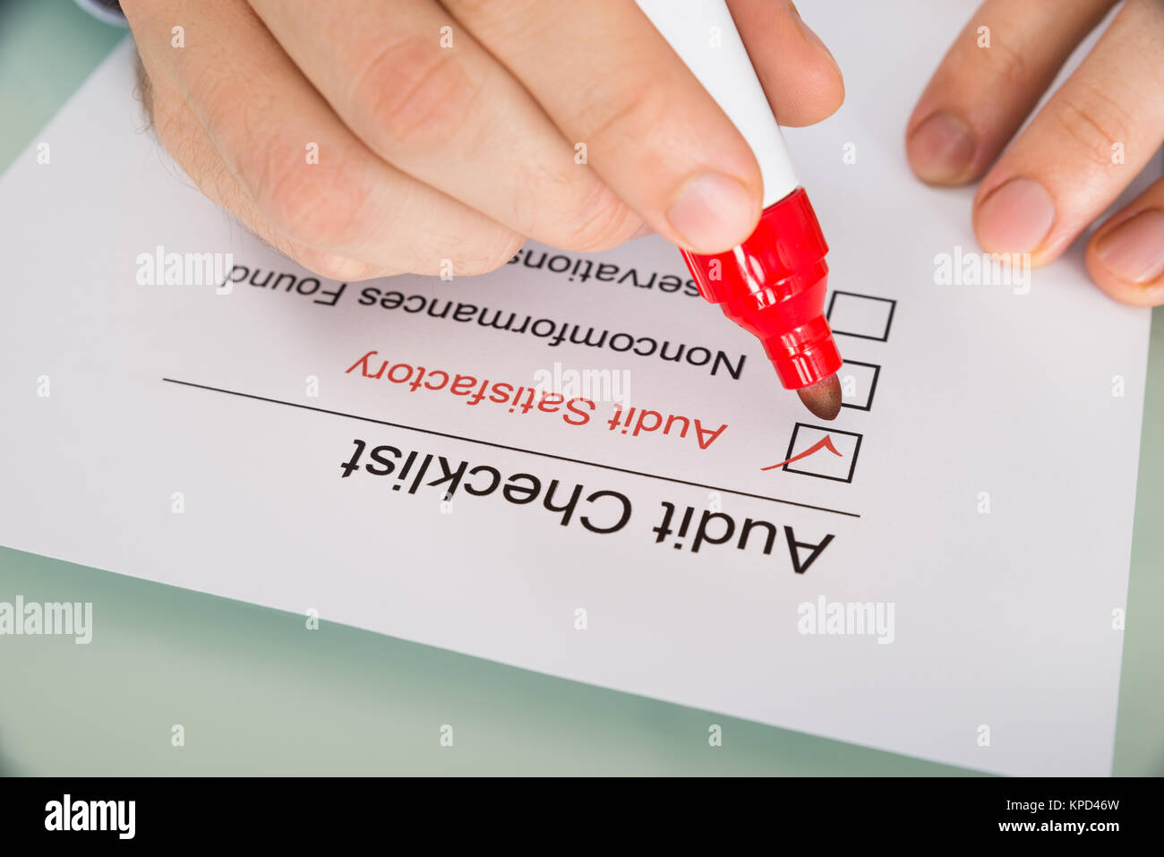 Person Filling Audit Checklist Form Stock Photo - Alamy