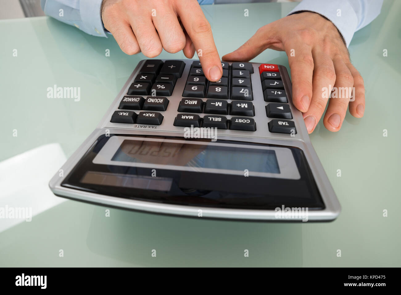 Persons hand typing calculator hi-res stock photography and images - Alamy
