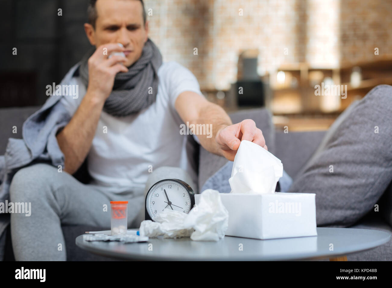 Ill male person going to clean his nose Stock Photo - Alamy