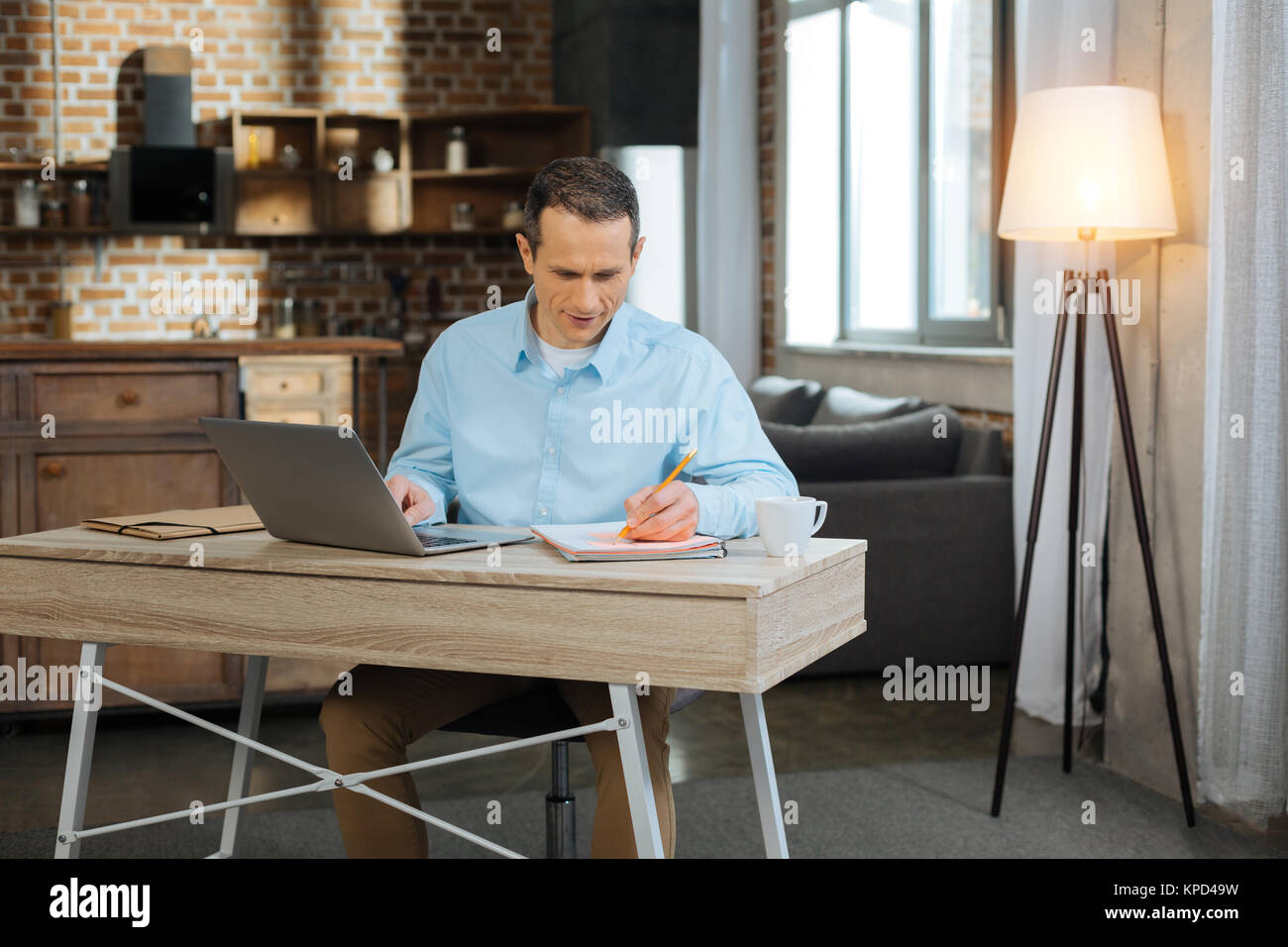 Concentrated male person making plans Stock Photo - Alamy