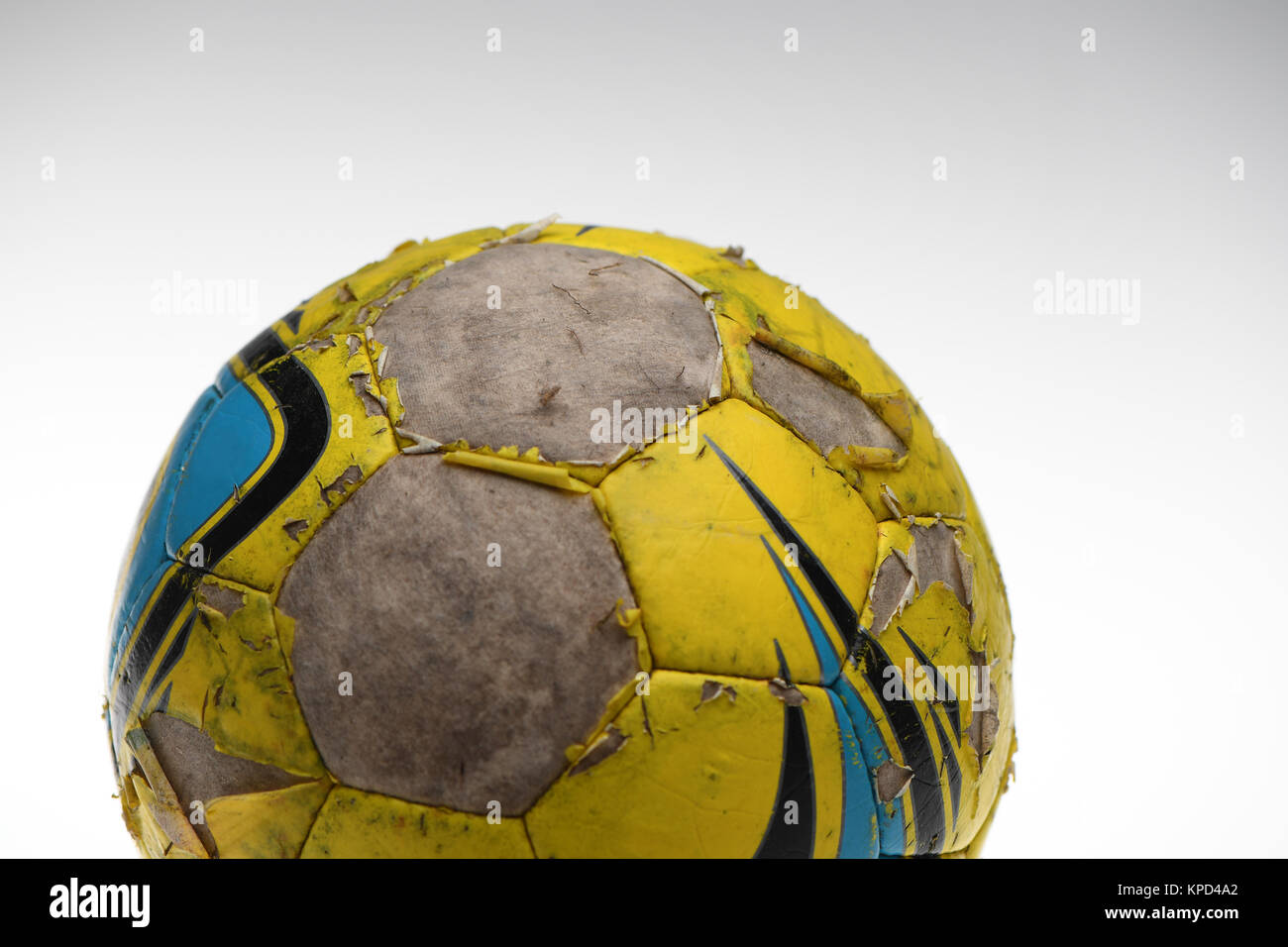 A very weathered football Stock Photo - Alamy
