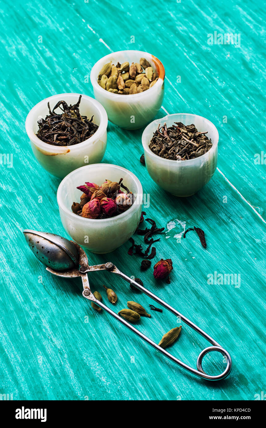 range of different varieties of tea leaves on wooden background Stock ...