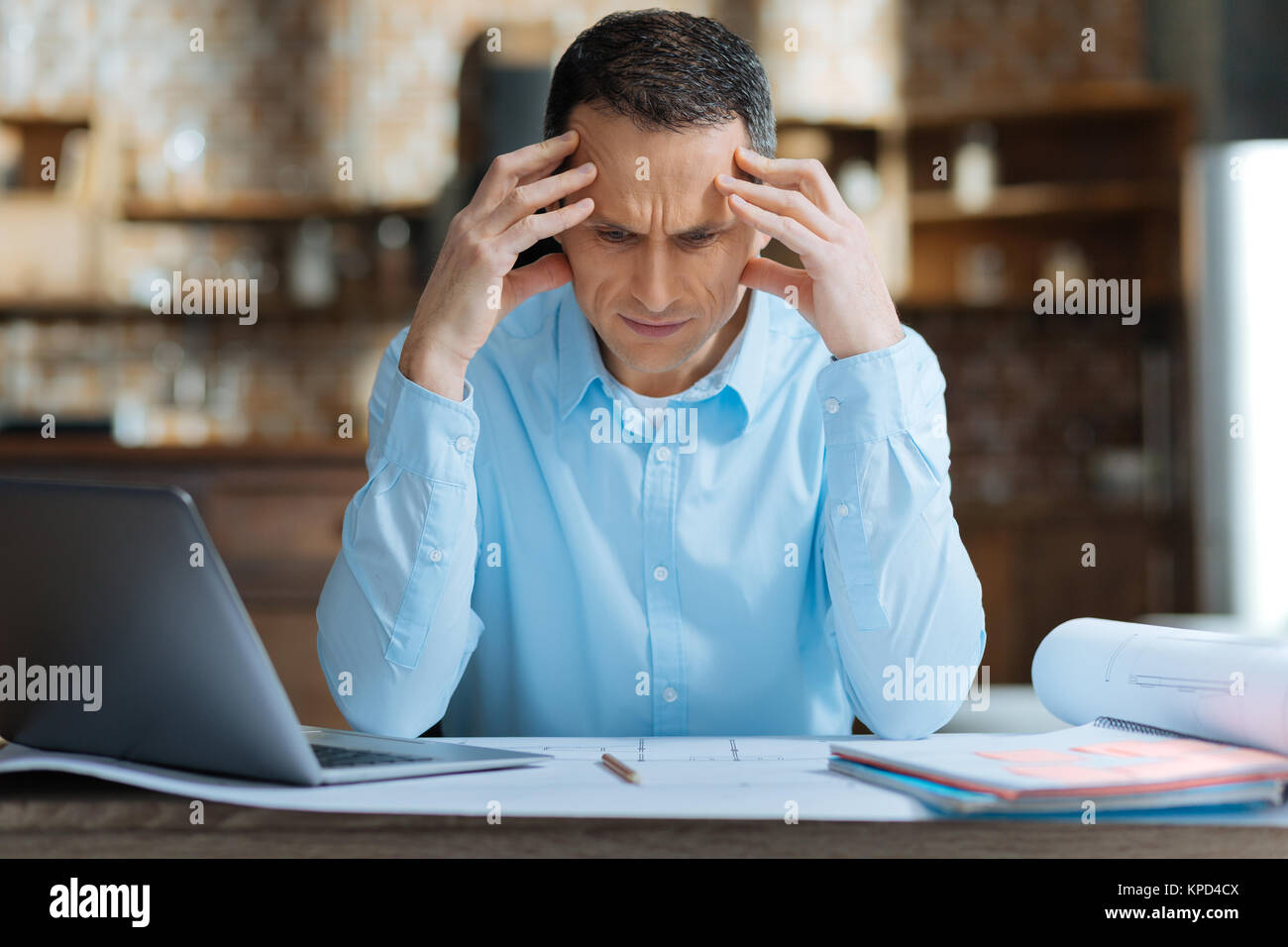 Concentrated man touching forehead hi-res stock photography and images ...