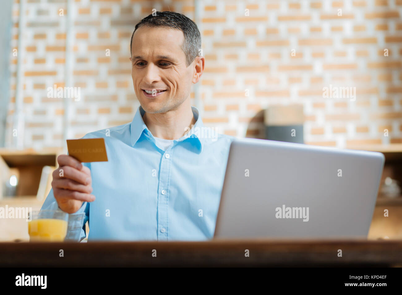 Delighted man shopping online hi-res stock photography and images - Alamy