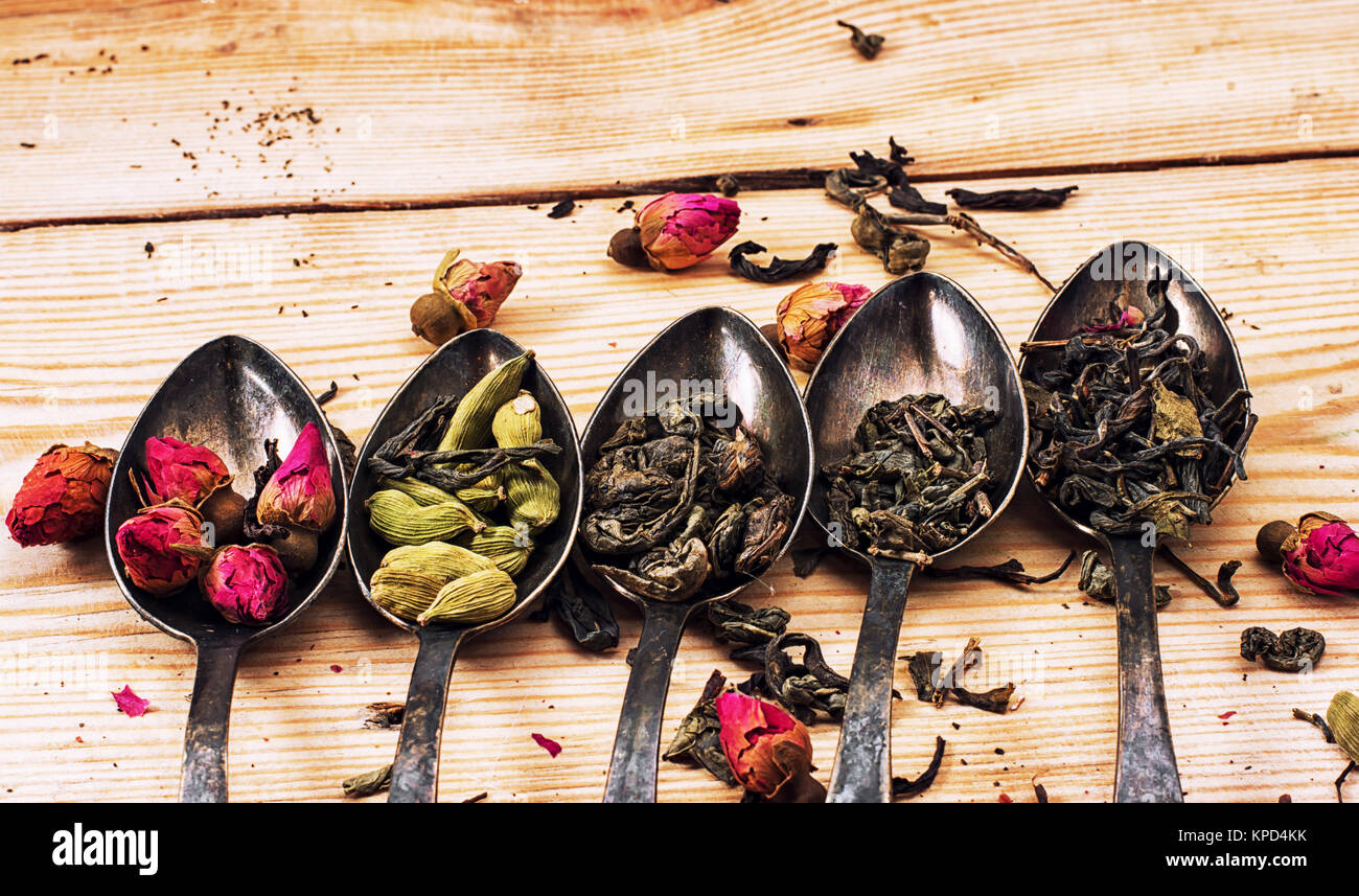 range of different varieties of tea leaves on wooden background Stock ...