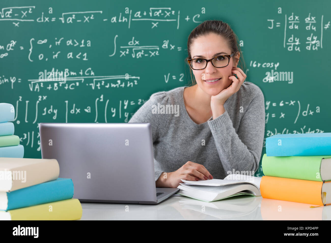 Woman Writing With Pen In Book Stock Photo - Alamy