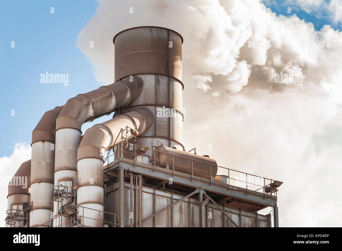 Old smokestack that emits white smoke Stock Photo - Alamy