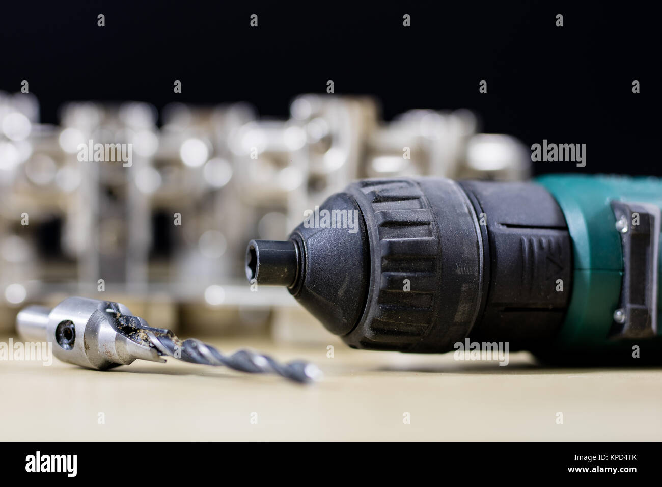 Carpentry tools and accessories on a workshop table. Hinges and screws ...