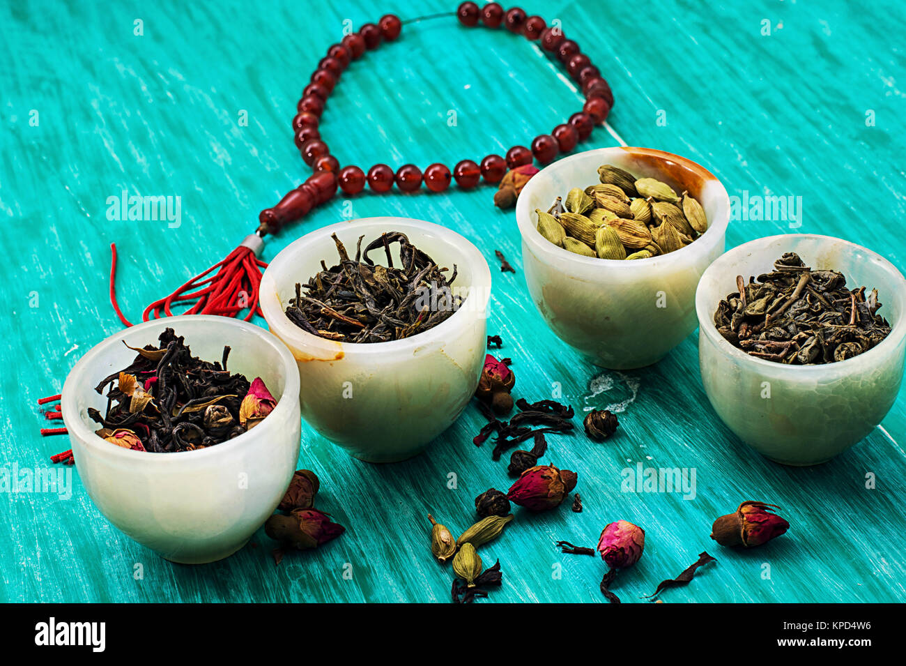 range of different varieties of tea leaves on wooden background Stock ...