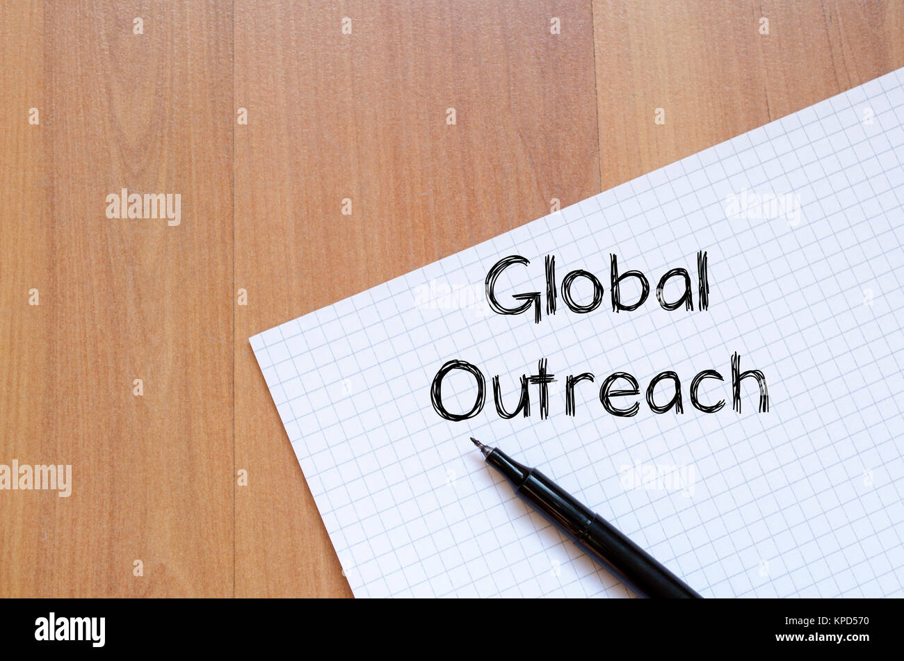 Global outreach write on notebook Stock Photo - Alamy