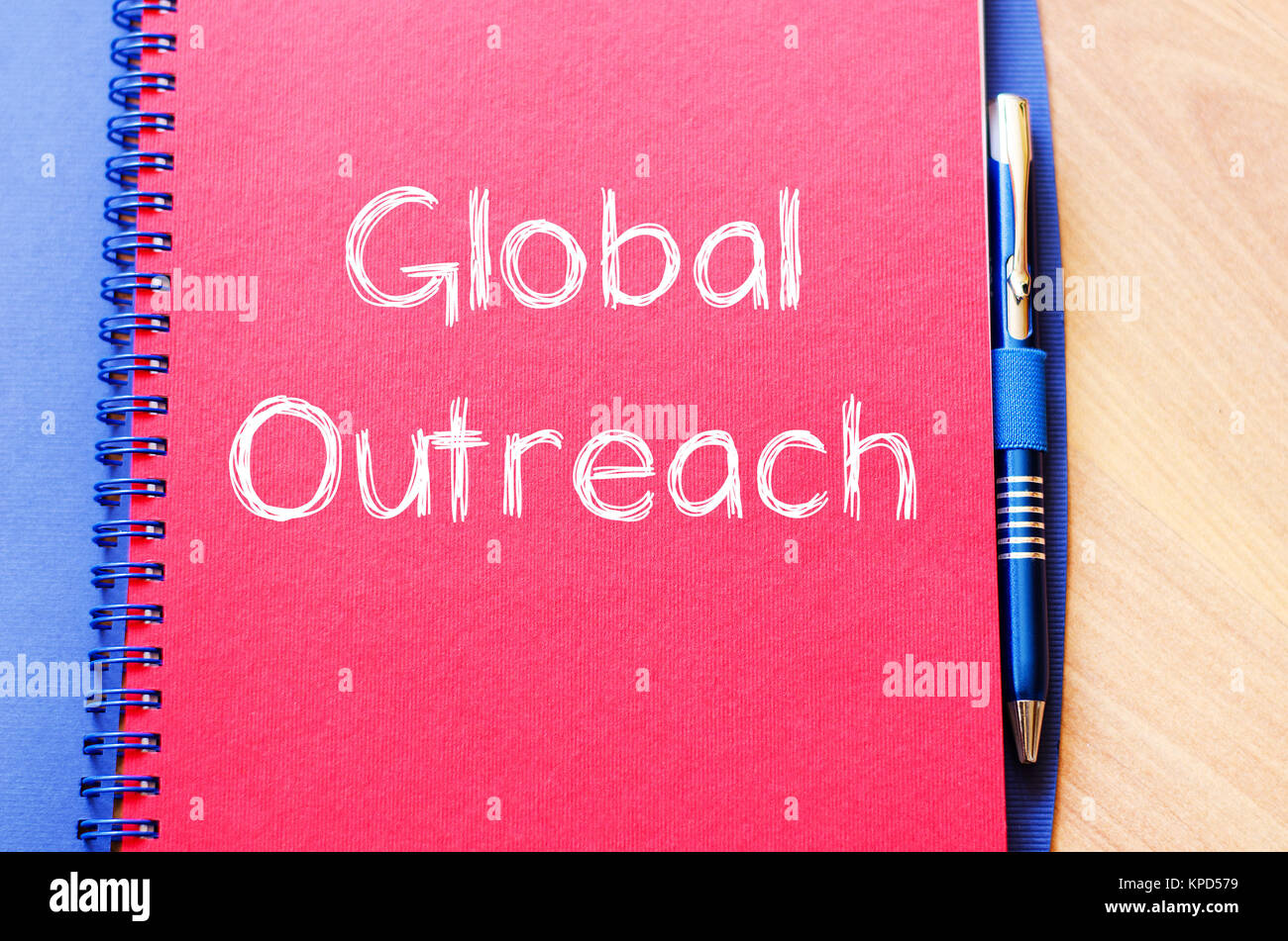 Global outreach write on notebook Stock Photo - Alamy