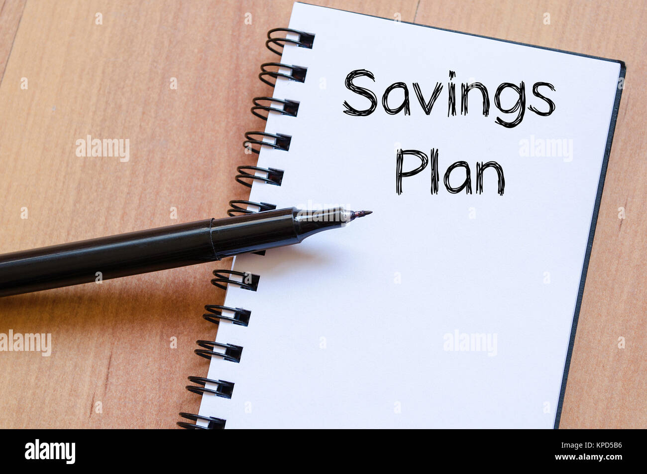 Savings plan write on notebook Stock Photo - Alamy