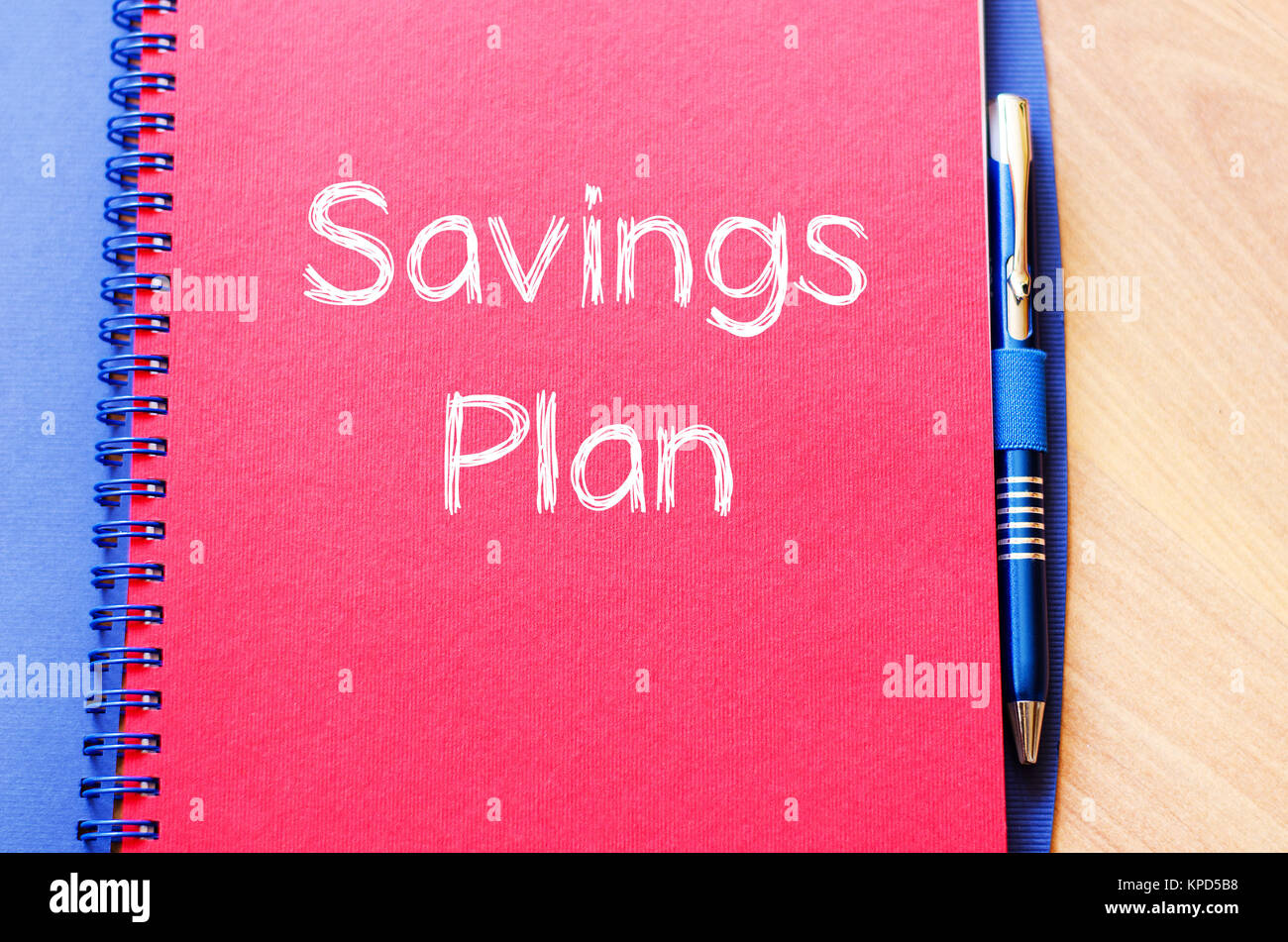 Savings plan write on notebook Stock Photo - Alamy