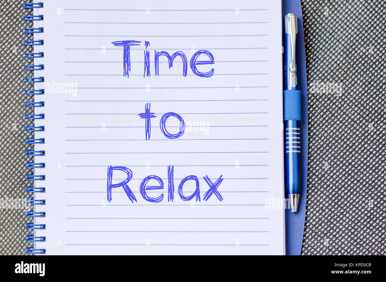 Time to relax write on notebook Stock Photo - Alamy