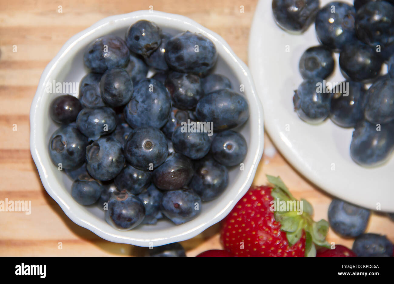 red fruits with rustic wood background Stock Photo - Alamy