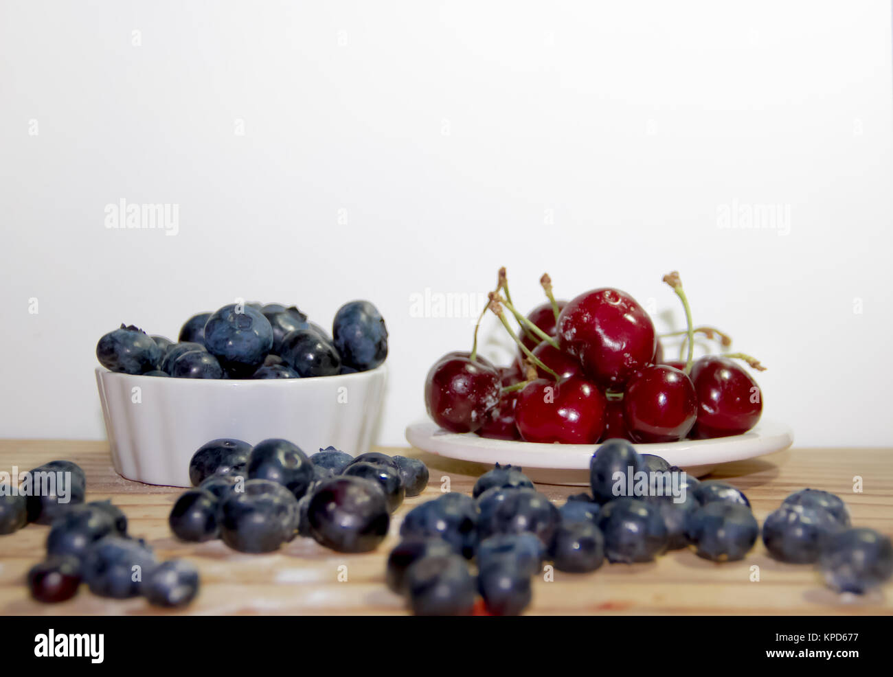 red fruits with rustic wood background Stock Photo - Alamy