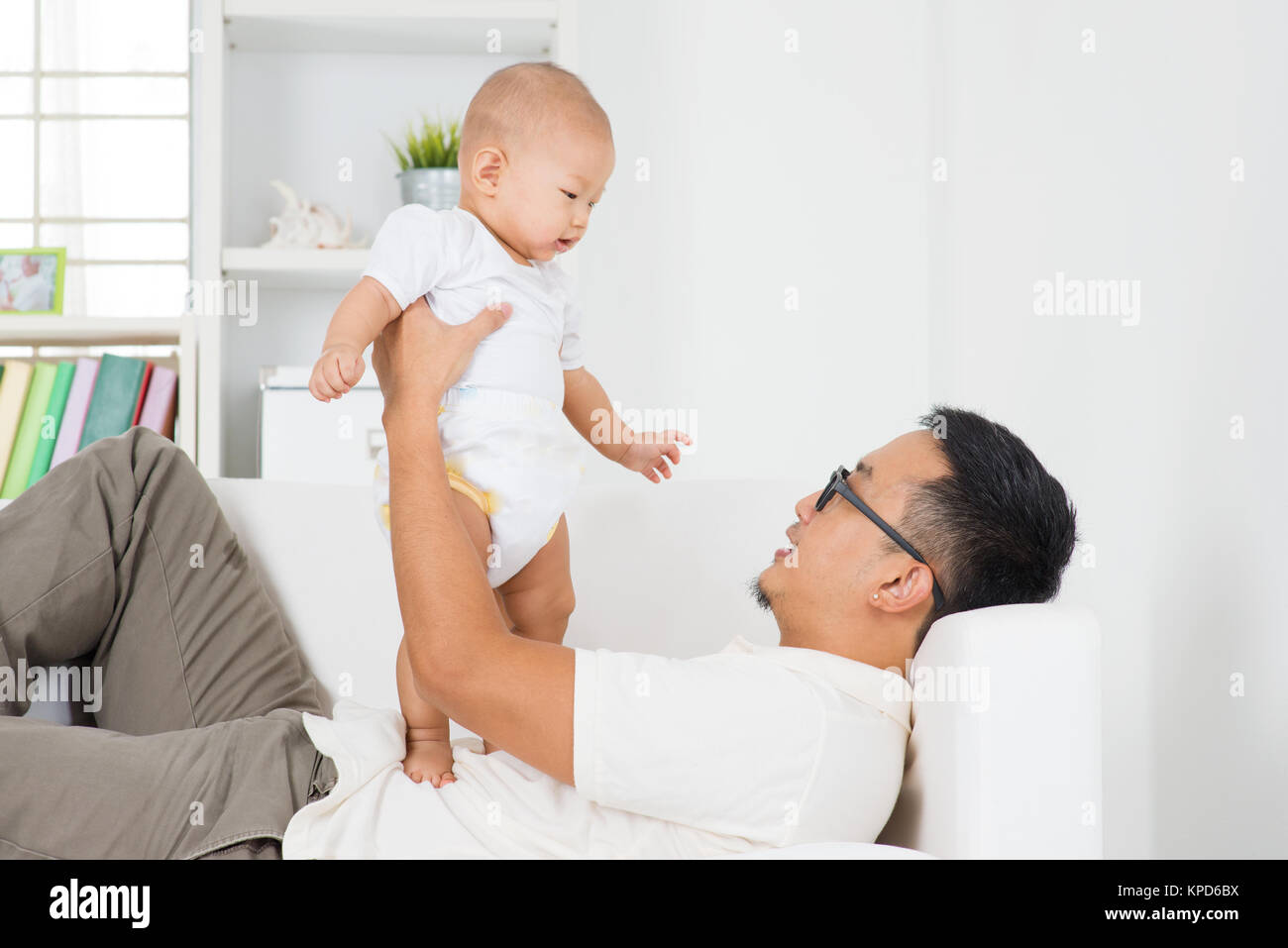 Father playing with baby boy Stock Photo - Alamy