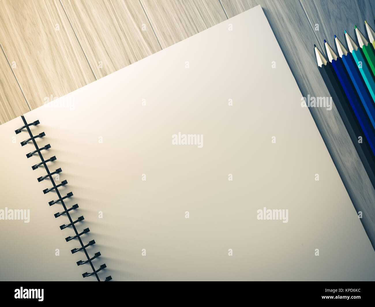 color pencil on checked notebook on wood background Stock Photo - Alamy