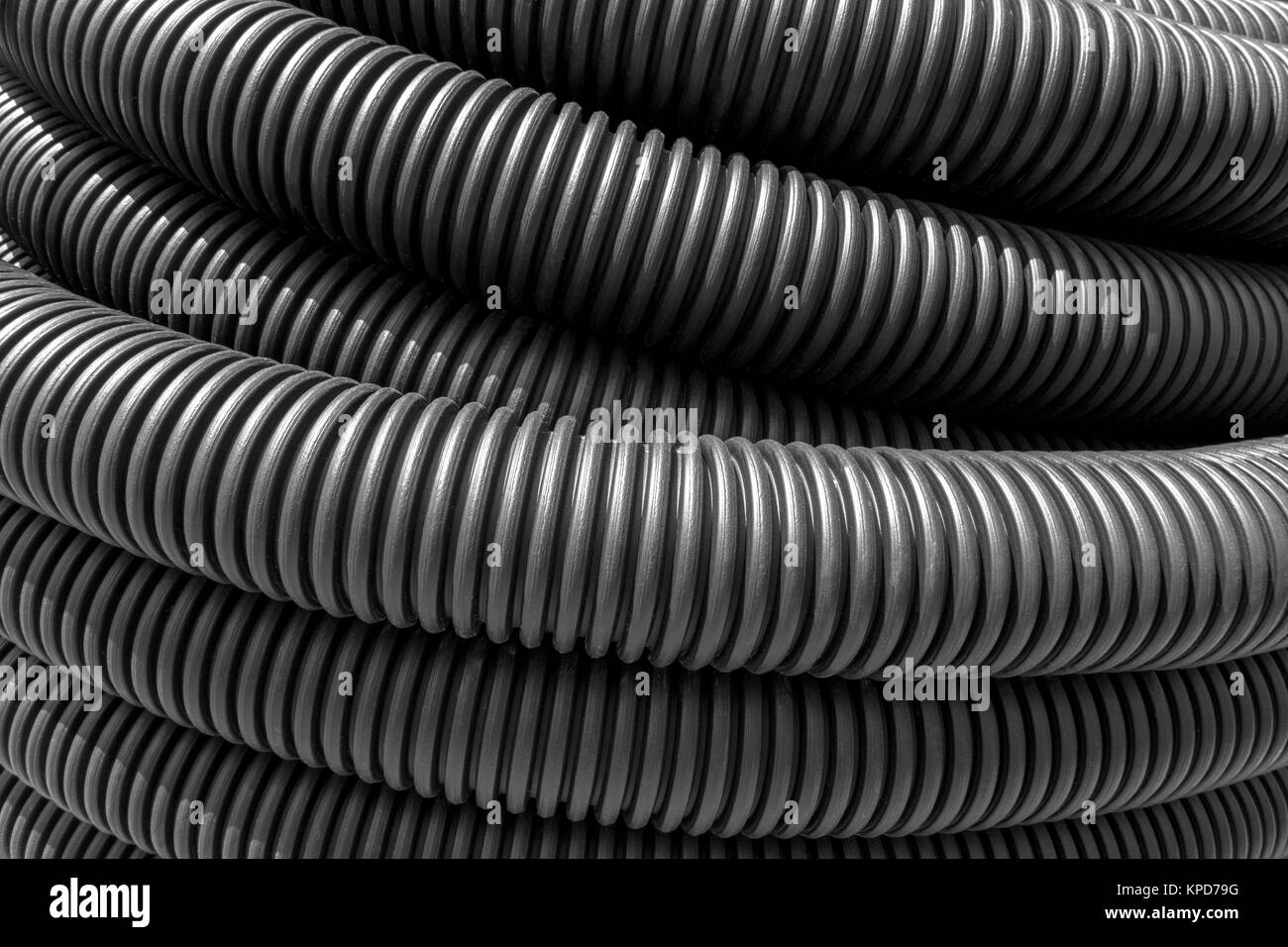 flexible,black,superimposed plastic pipes in close up Stock Photo - Alamy