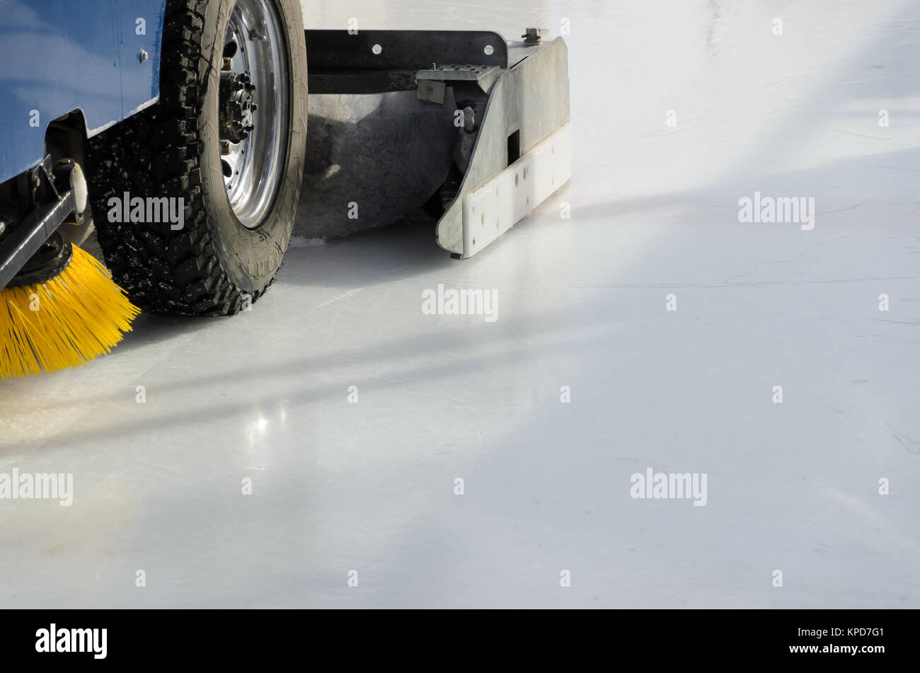 Machine polishing the ice before the hockey game Stock Photo - Alamy