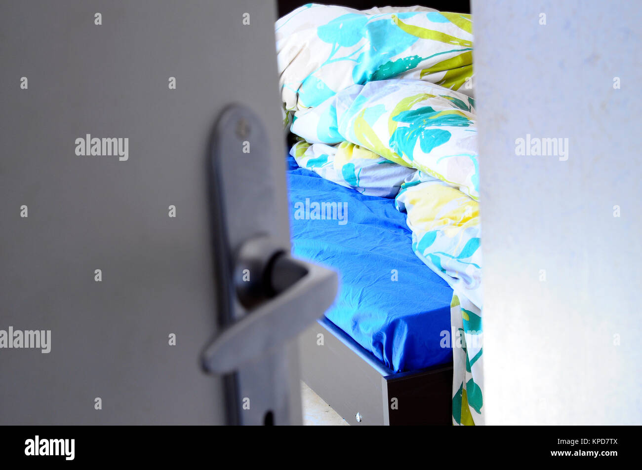 View through open door on mess in bedroom Stock Photo - Alamy