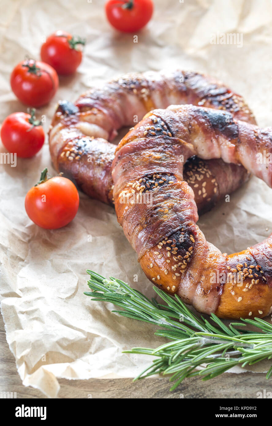 Bagels with sesame wrapped in bacon rashers Stock Photo - Alamy