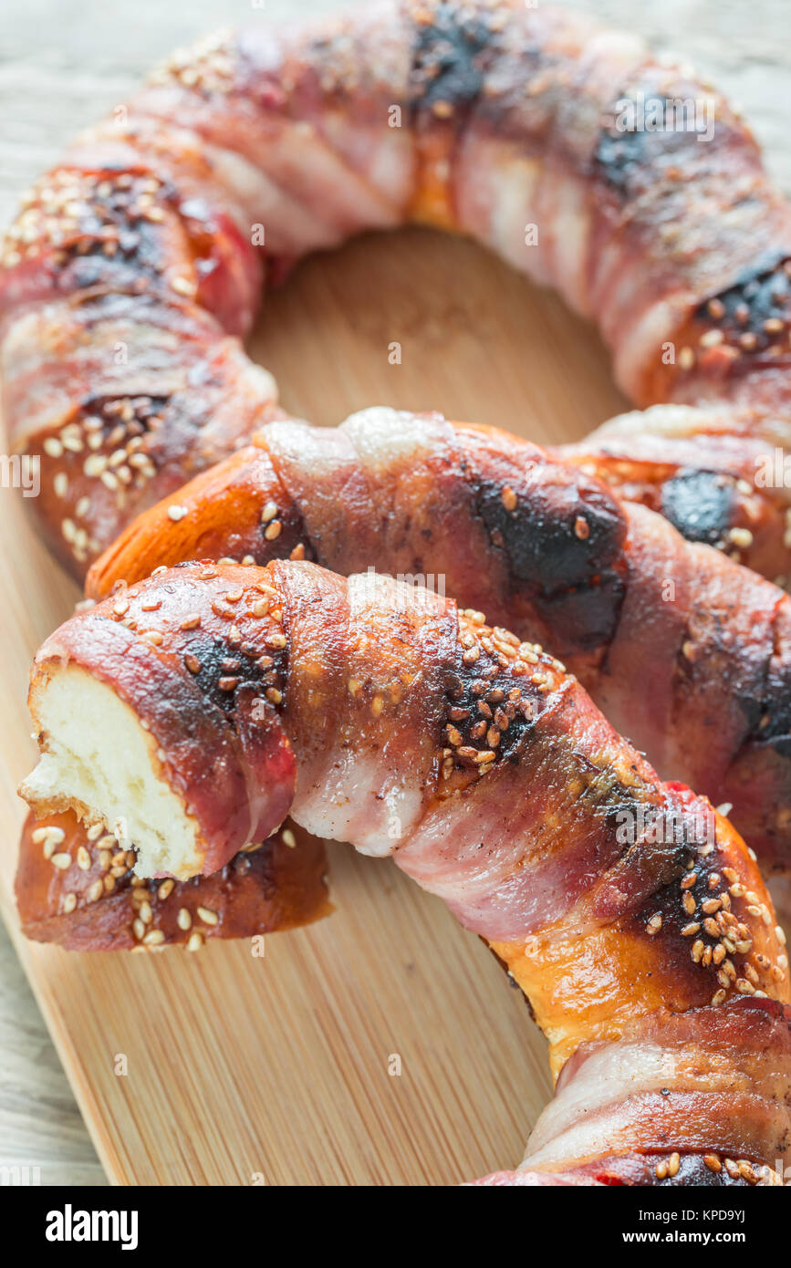 Bagels with sesame wrapped in bacon rashers Stock Photo - Alamy