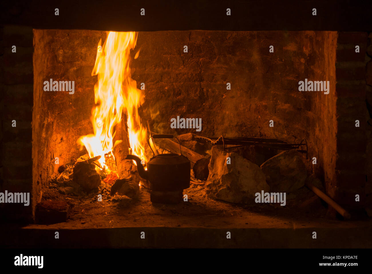Fire fireplace traditional kettle winter time Stock Photo - Alamy