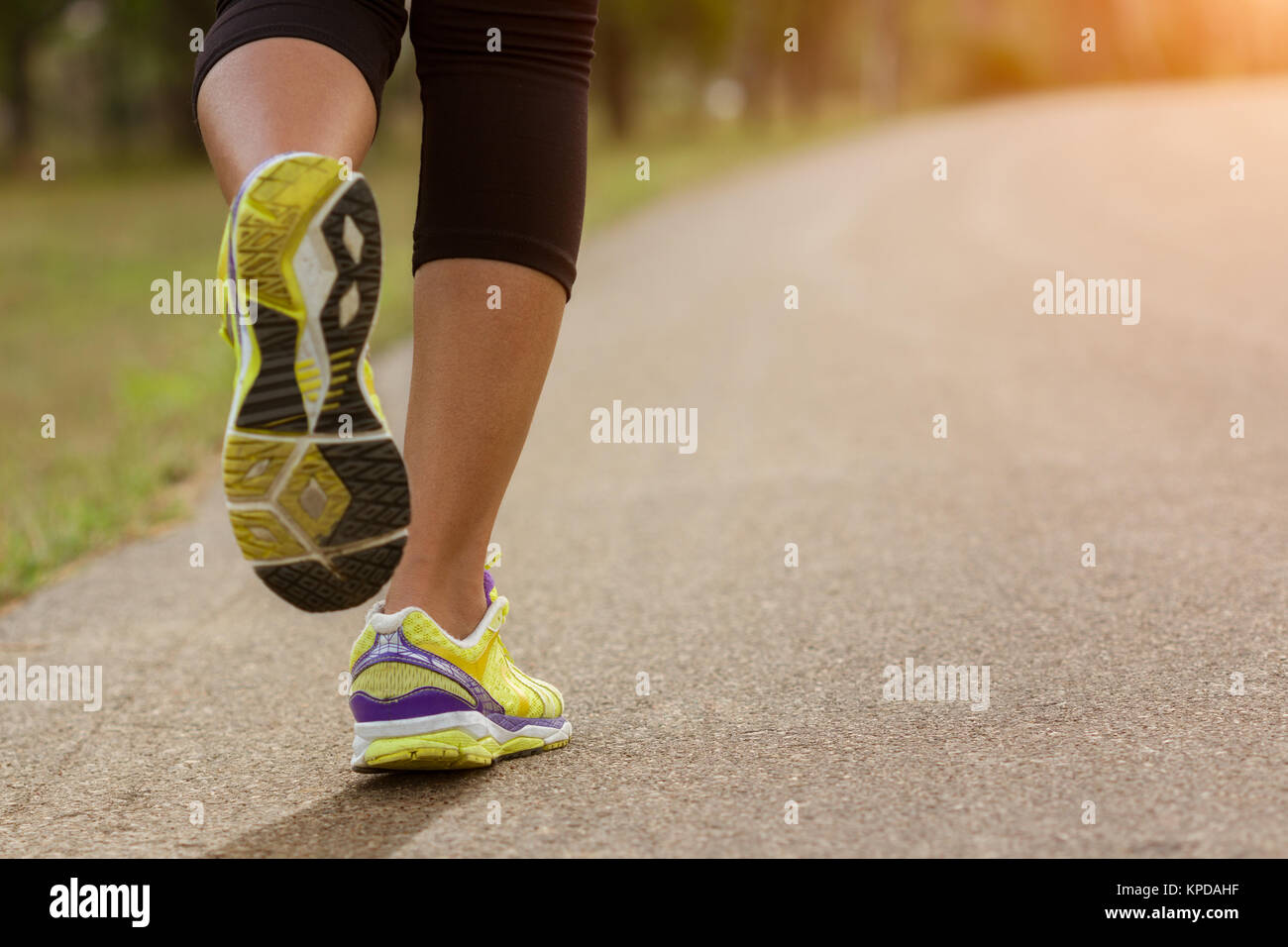 close up sport woman running in park during sunset Stock Photo - Alamy