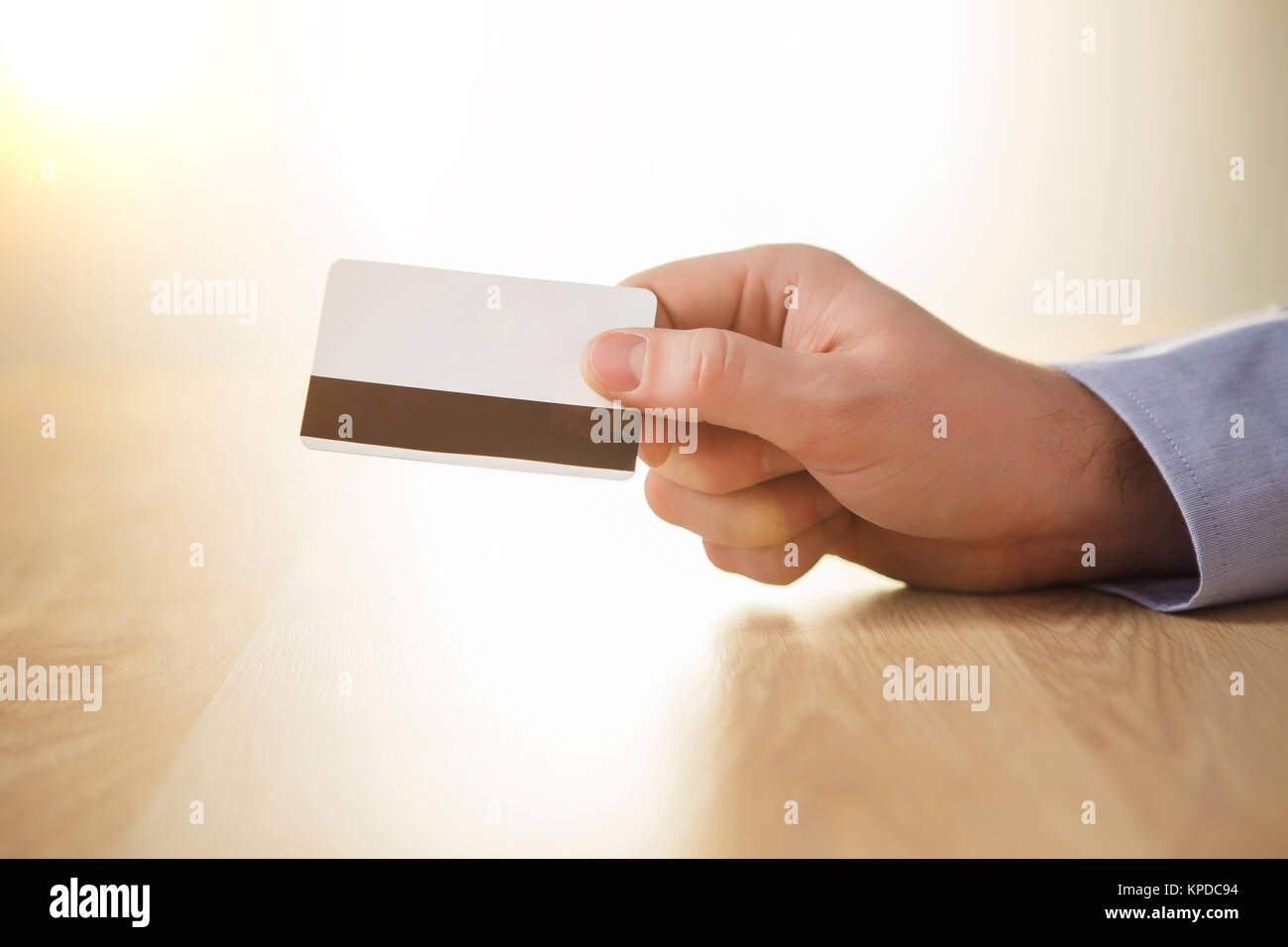 The male hand showing credit card Stock Photo - Alamy