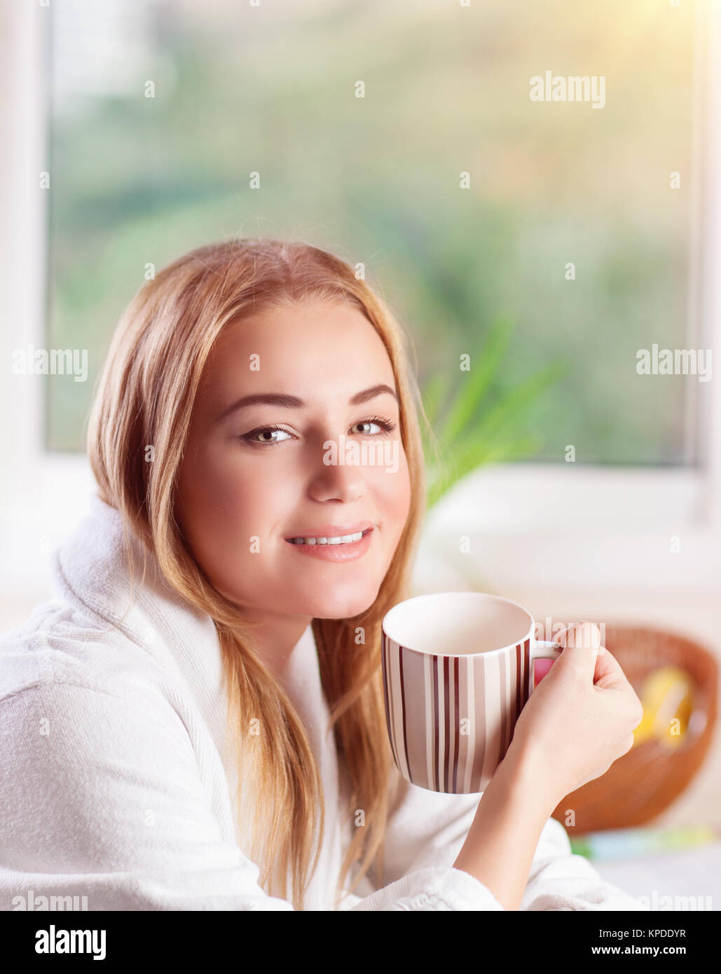 Cute girl drinking coffee Stock Photo - Alamy