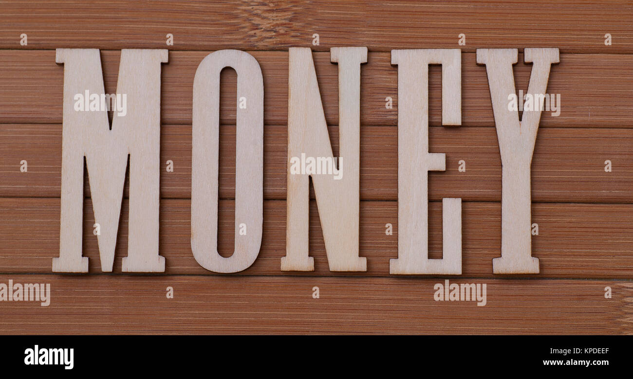 wooden letters spelling money Stock Photo - Alamy
