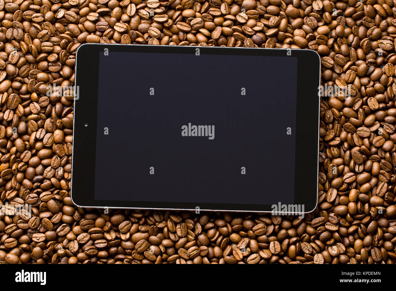 computer tablet on coffee beans Stock Photo - Alamy