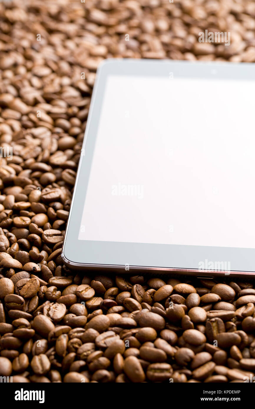 computer tablet on coffee beans Stock Photo - Alamy